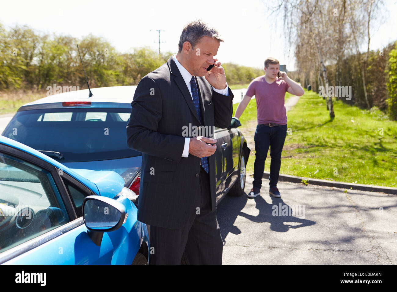 Two Drivers Inspecting Damage After Traffic Accident Stock Photo - Alamy