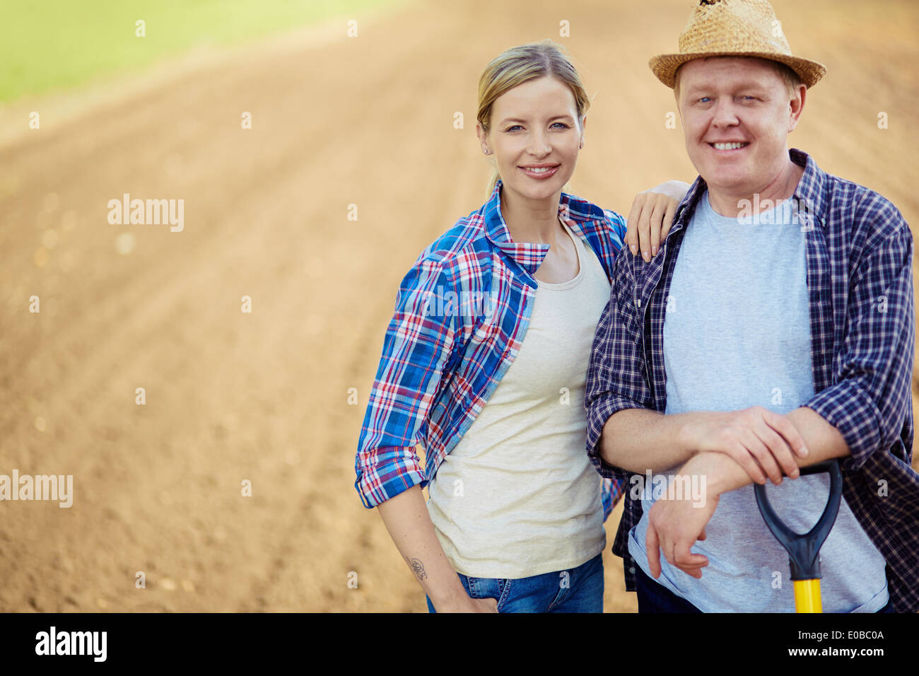 Image of two happy farmers on background of plowed field Stock Photo ...