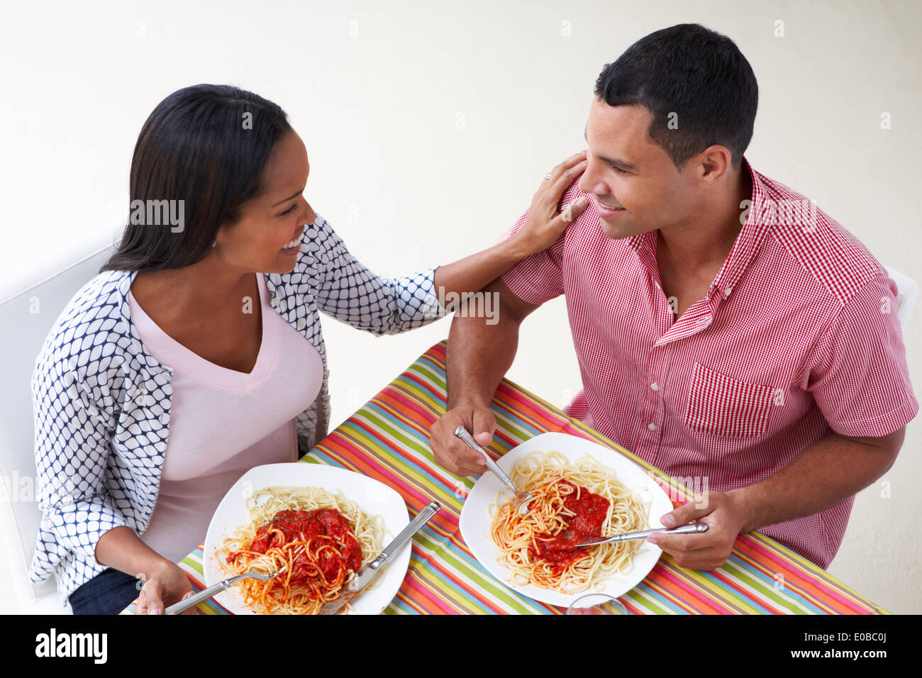 Overhead View Of Couple Eating Meal Together Stock Photo - Alamy