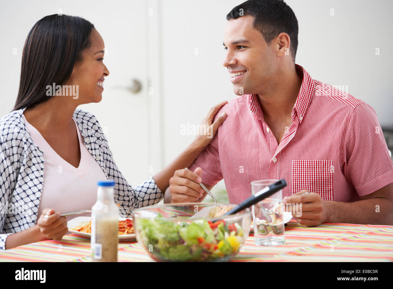 Couple Eating Meal Together At Home Stock Photo - Alamy