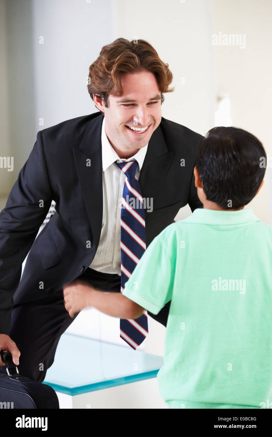 Son Greets Father On Return From Work Stock Photo - Alamy