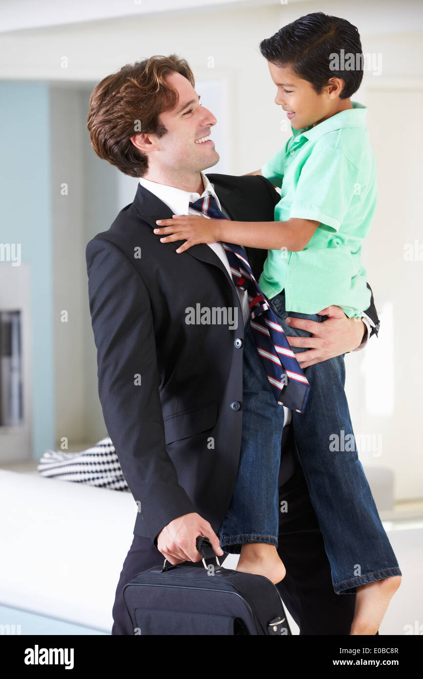 Son Greets Father On Return From Work Stock Photo - Alamy