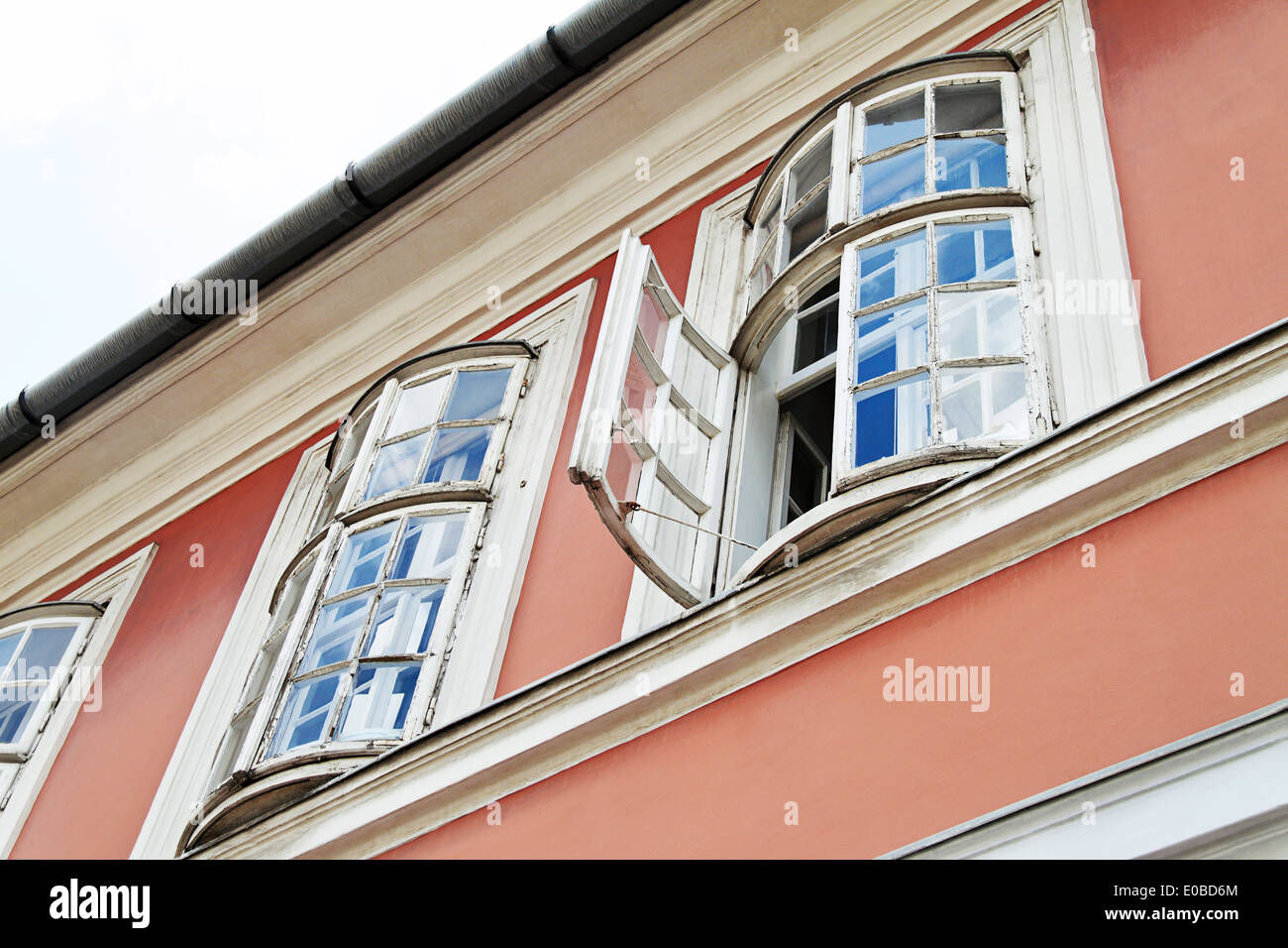 Old building window in an old dwelling house. Warm loss by wooden ...