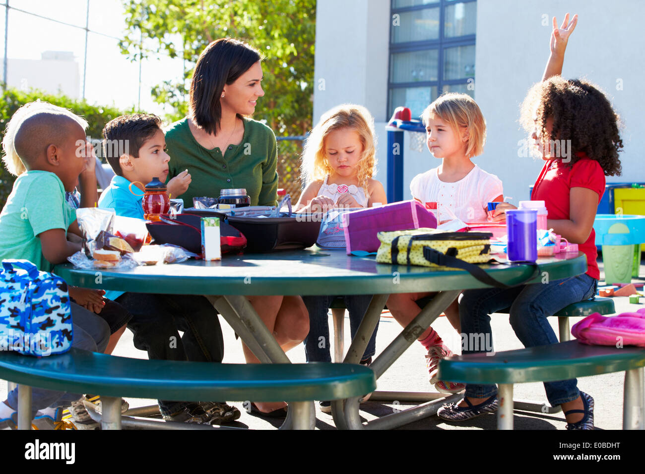 Teacher supervising children hi-res stock photography and images - Alamy