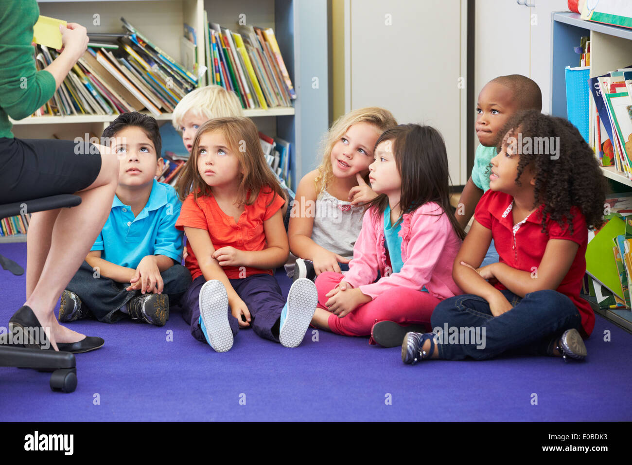 Group of Elementary Pupils In Classroom Working With Teacher Stock ...