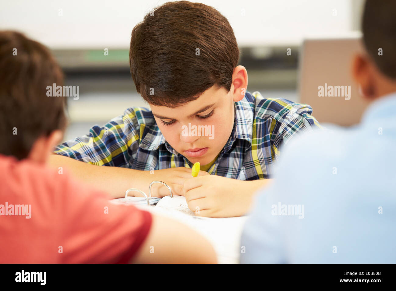 Pupils Studying At Desks In Classroom Stock Photo - Alamy