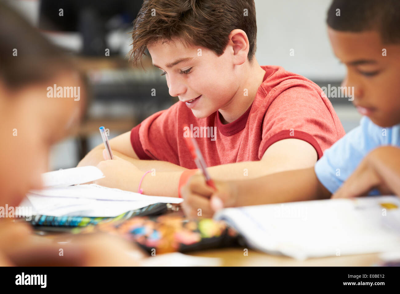 Pupils Studying At Desks In Classroom Stock Photo - Alamy
