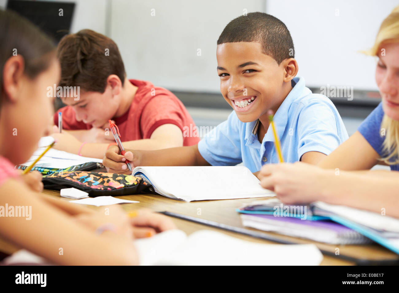 Pupils Studying At Desks In Classroom Stock Photo - Alamy