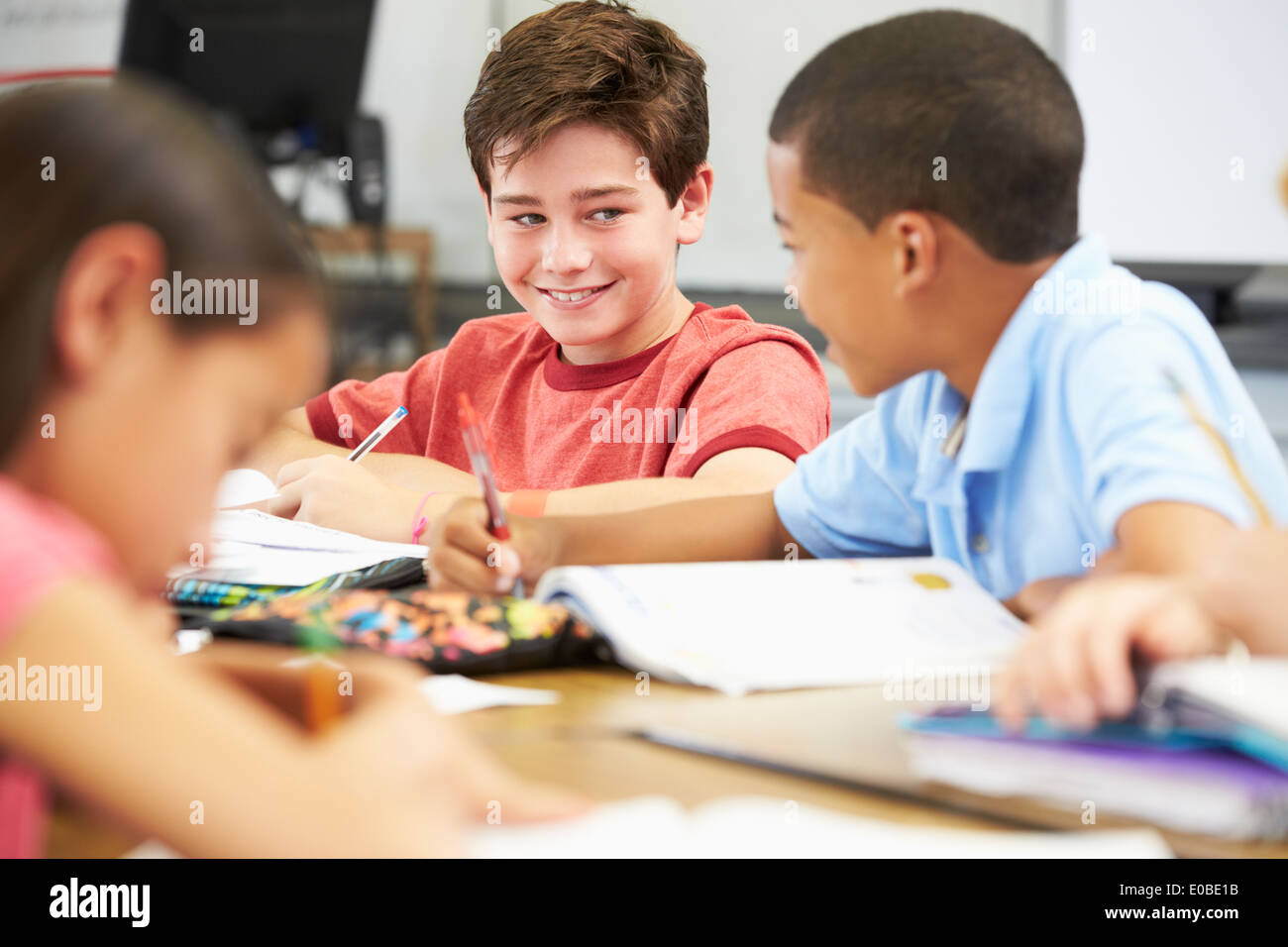 Pupils Studying At Desks In Classroom Stock Photo - Alamy