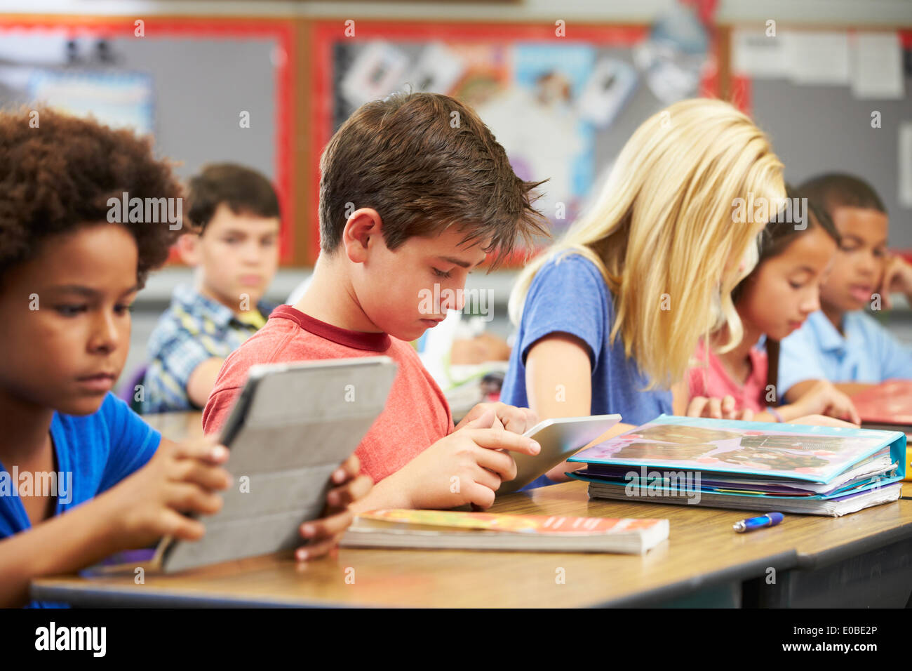 Pupils In Class Using Digital Tablet Stock Photo - Alamy