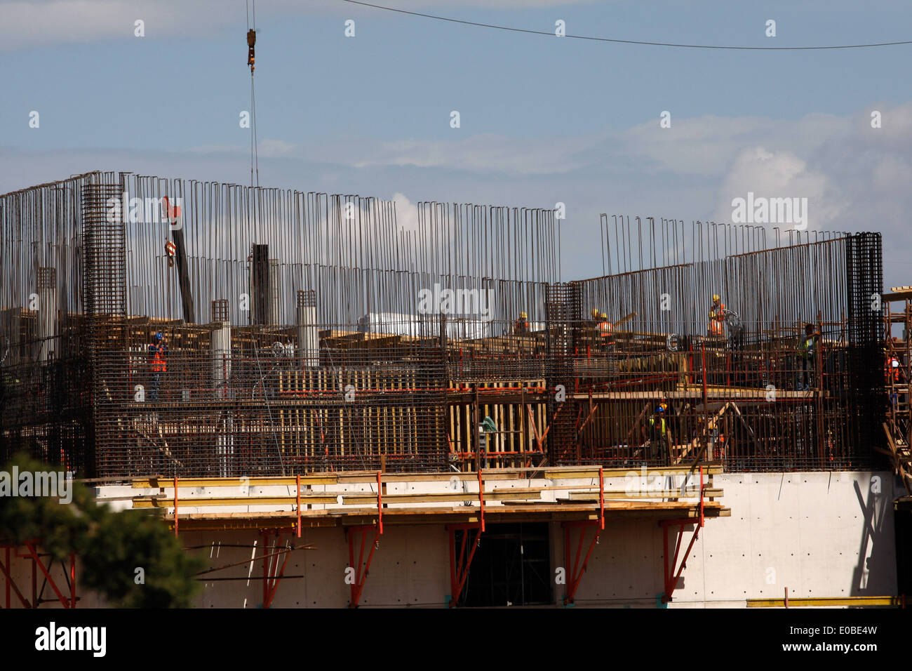 Workers install medal rods at the construction site of the Stavros ...
