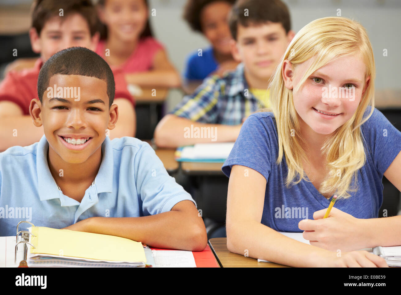 Pupils Studying At Desks In Classroom Stock Photo - Alamy