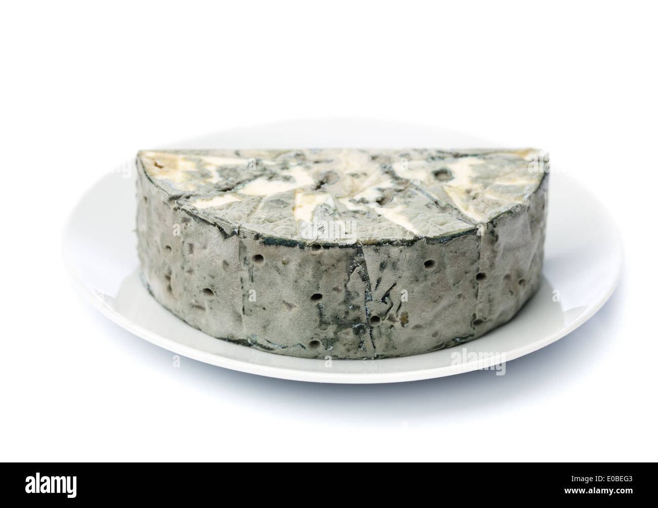 Cheese with black mold on the plate. Isolated on white background Stock ...
