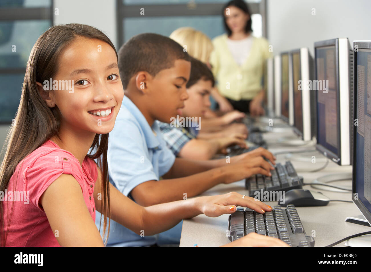 Elementary Students Working At Computers In Classroom Stock Photo - Alamy Elementary Students Working At Computers In Classroom Stock Photo - Alamy