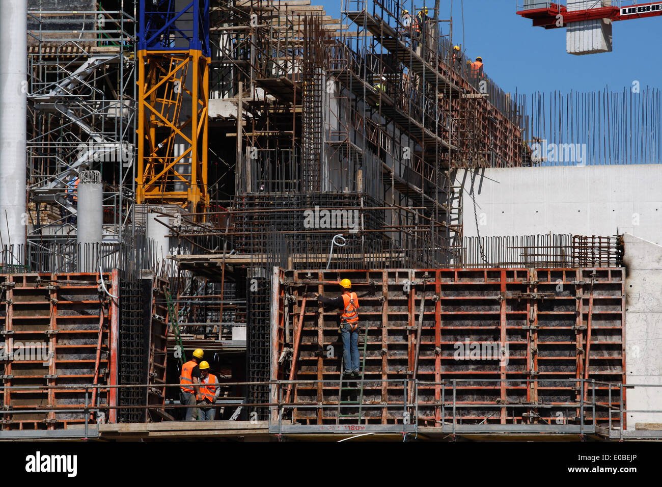Workers install medal rods at the construction site of the Stavros ...