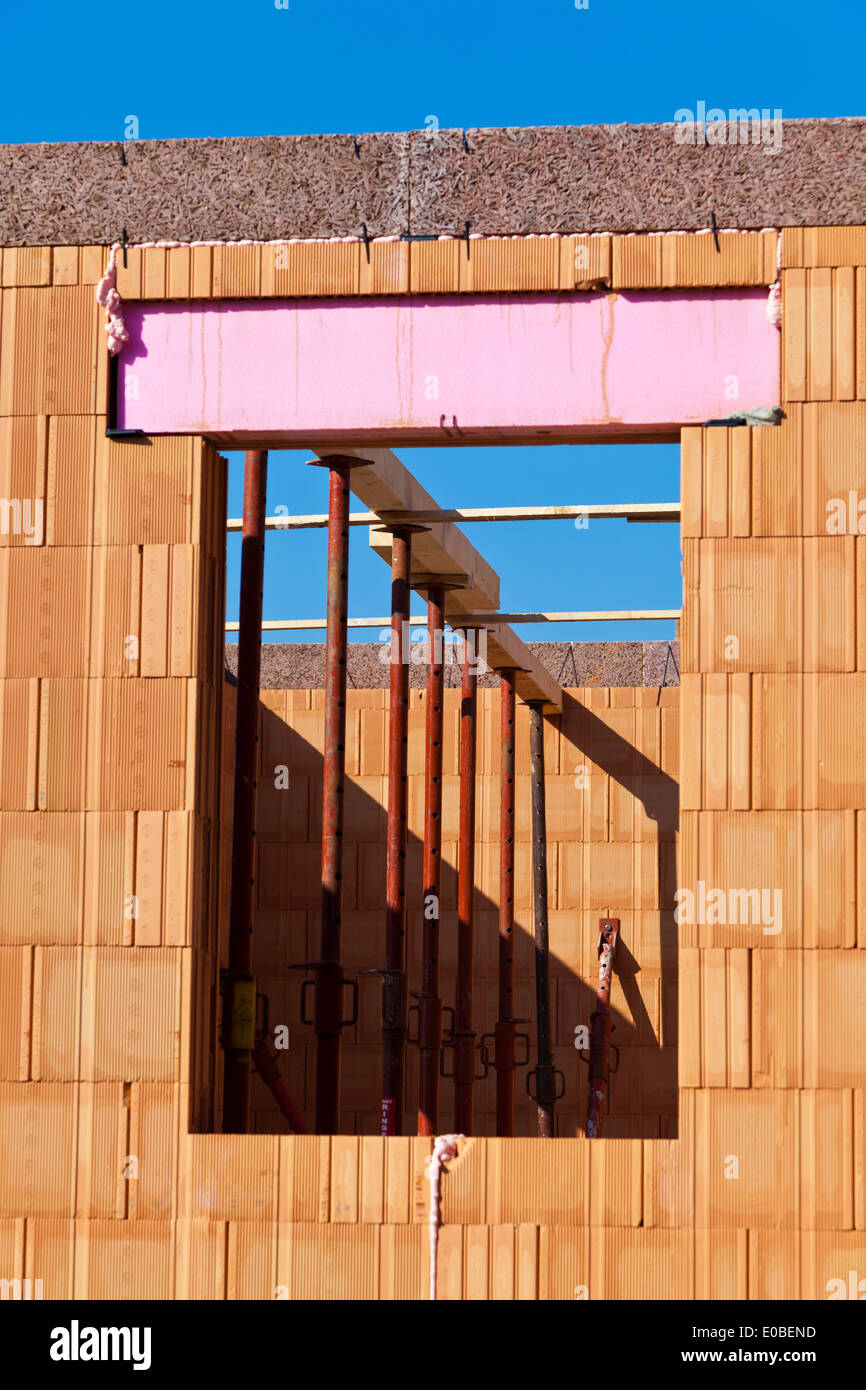 A brick shell of a house in massive construction. Established in bricks ...