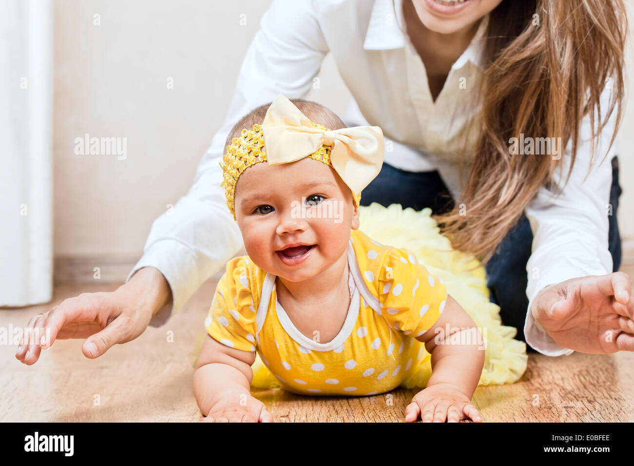 Happy young mum with the baby Stock Photo - Alamy