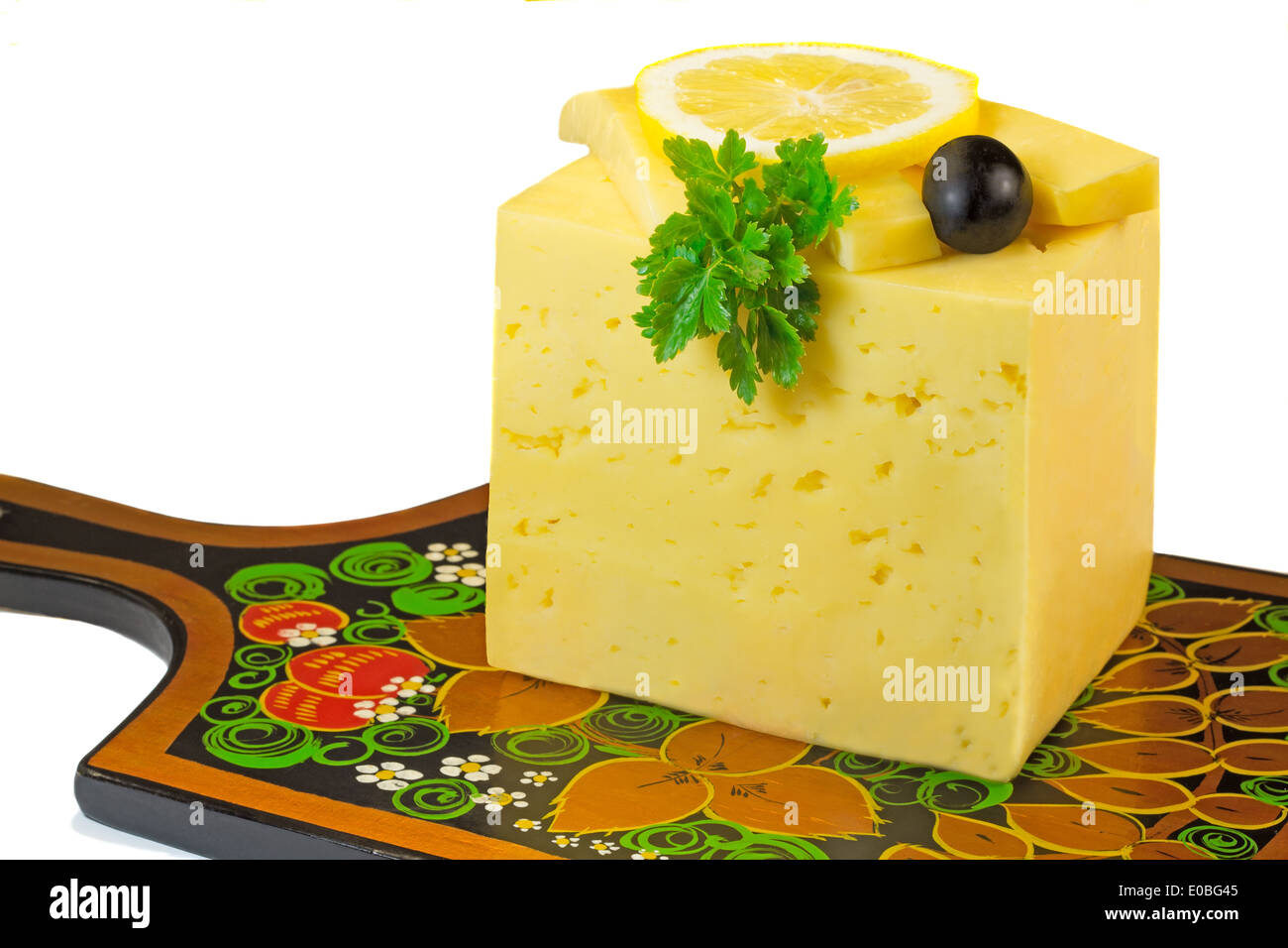 Piece of the yellow porous cheese, the cut slices of cheese, lemon and ...