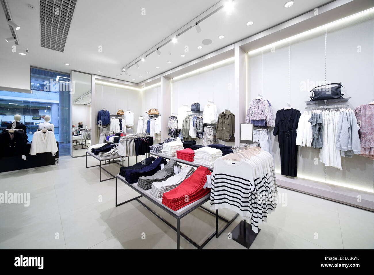 luxury and fashionable brand new interior of cloth store Stock Photo ...