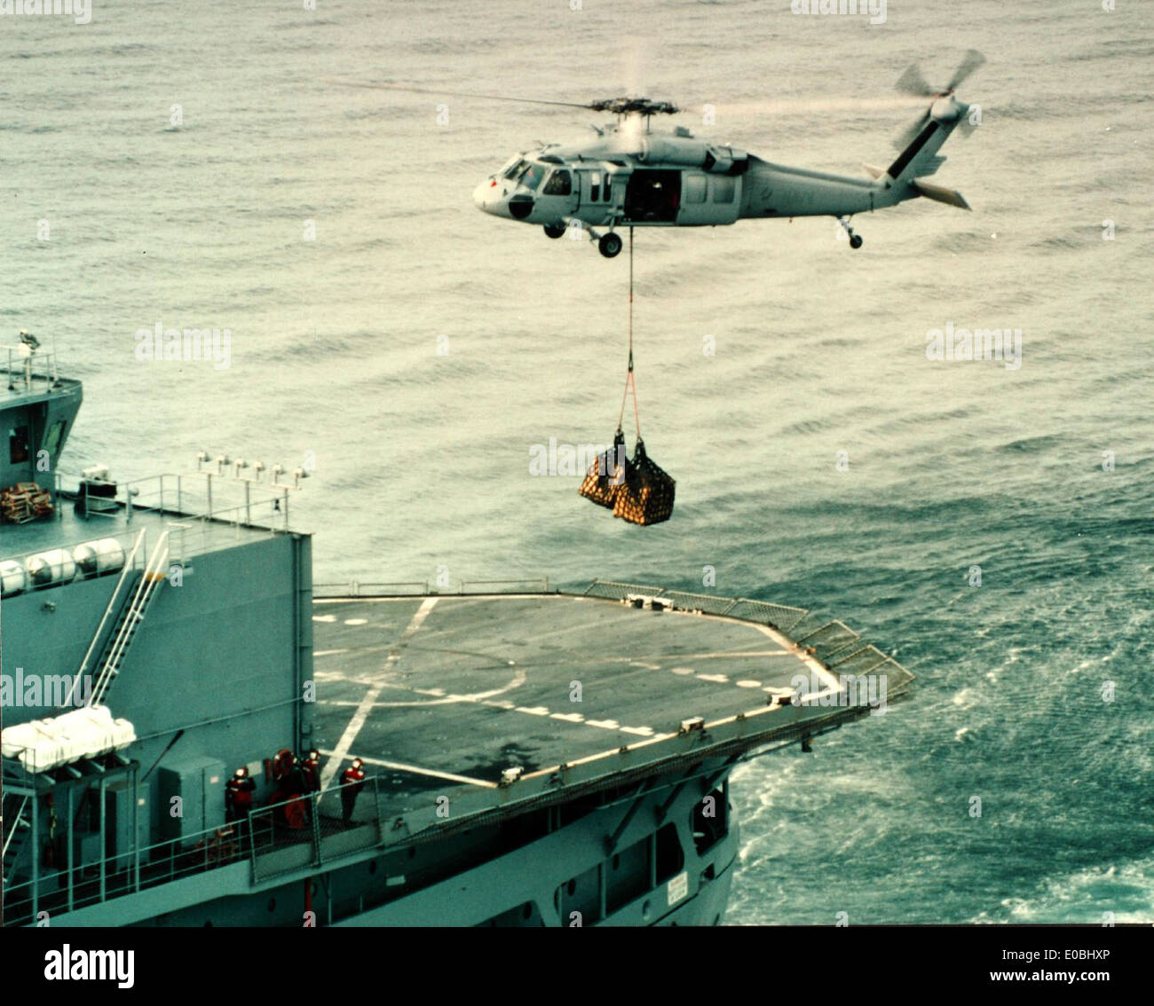 The CH-60 helicopter is seen approaching for a vertical replenishment ...