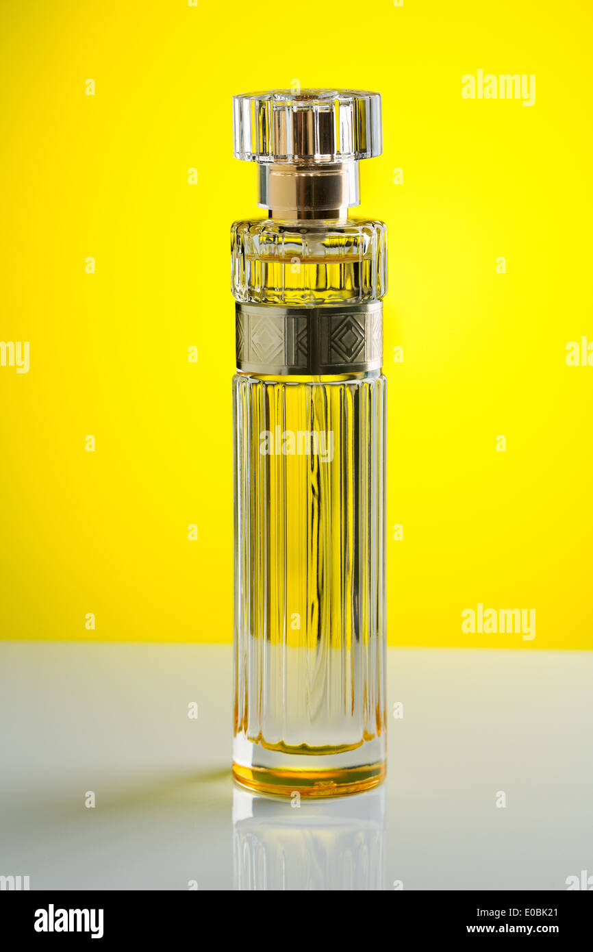 Cylindrical perfume bottle on a yellow gradient background Stock Photo ...