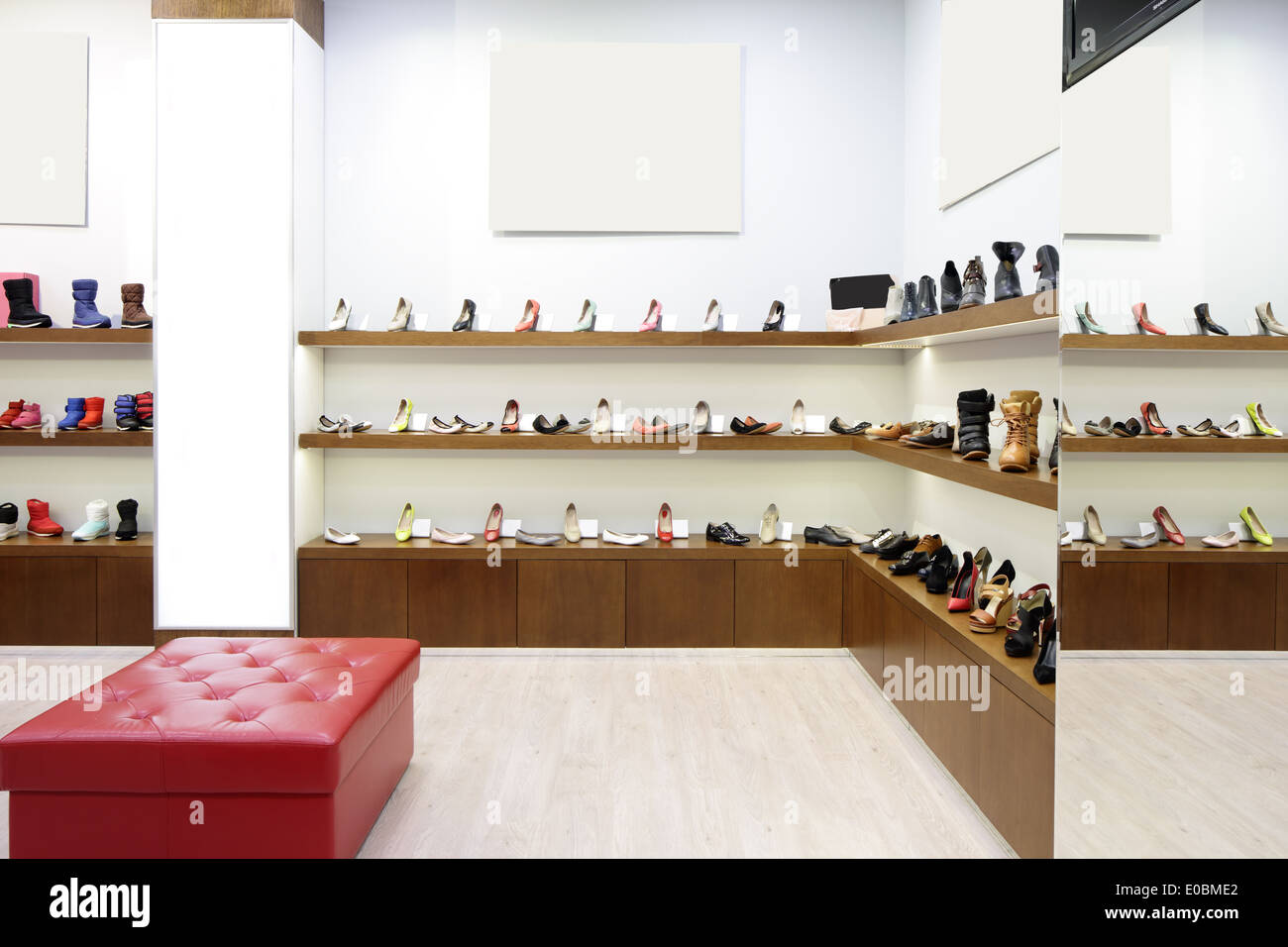 bright and fashionable interior of shoe store in modern mall Stock ...
