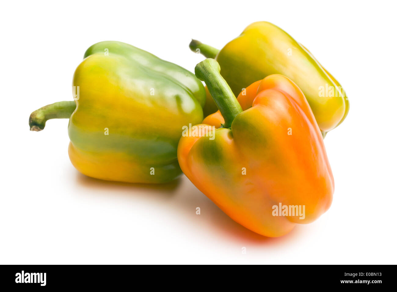 colored peppers on white background Stock Photo - Alamy