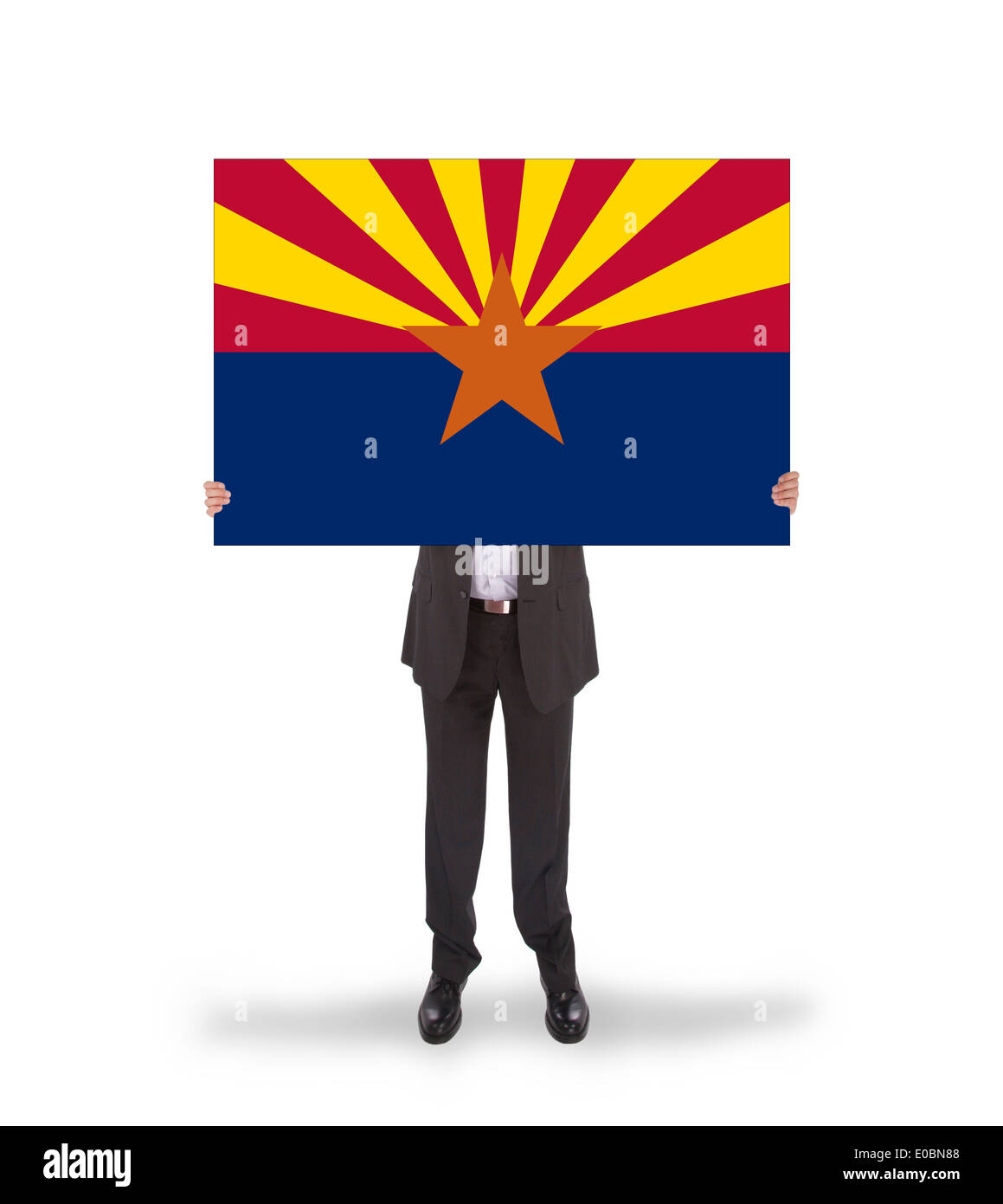 Smiling businessman holding a big card flag of Arizona isolated on ...