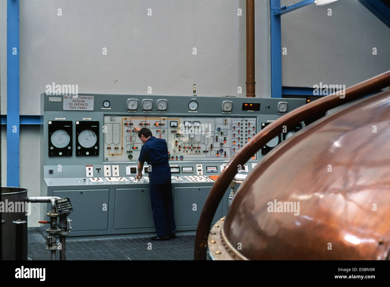 Scottish distillery worker by controls to distilling process Stock ...