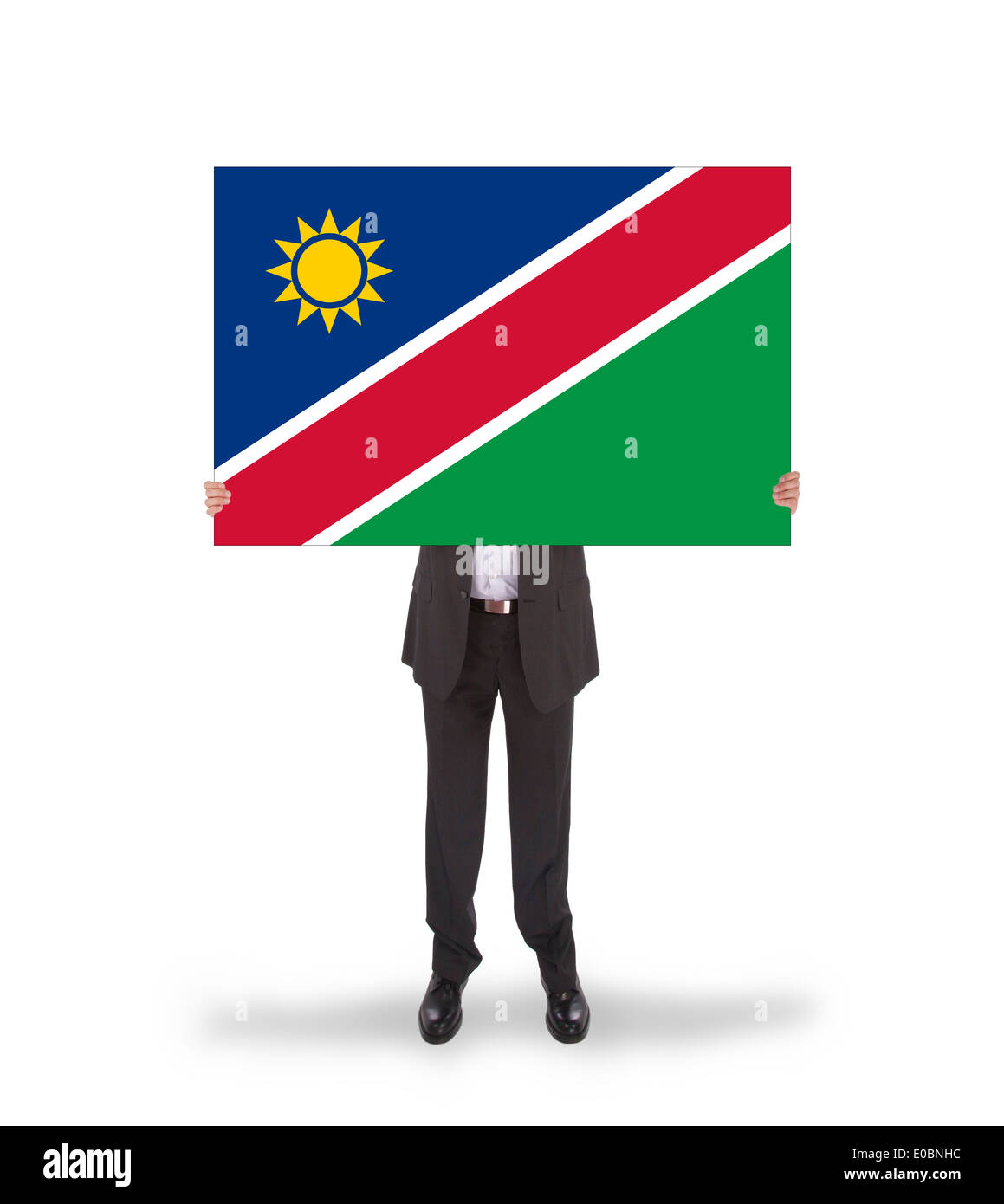 Businessman holding a big card flag of Namibia isolated on white Stock ...