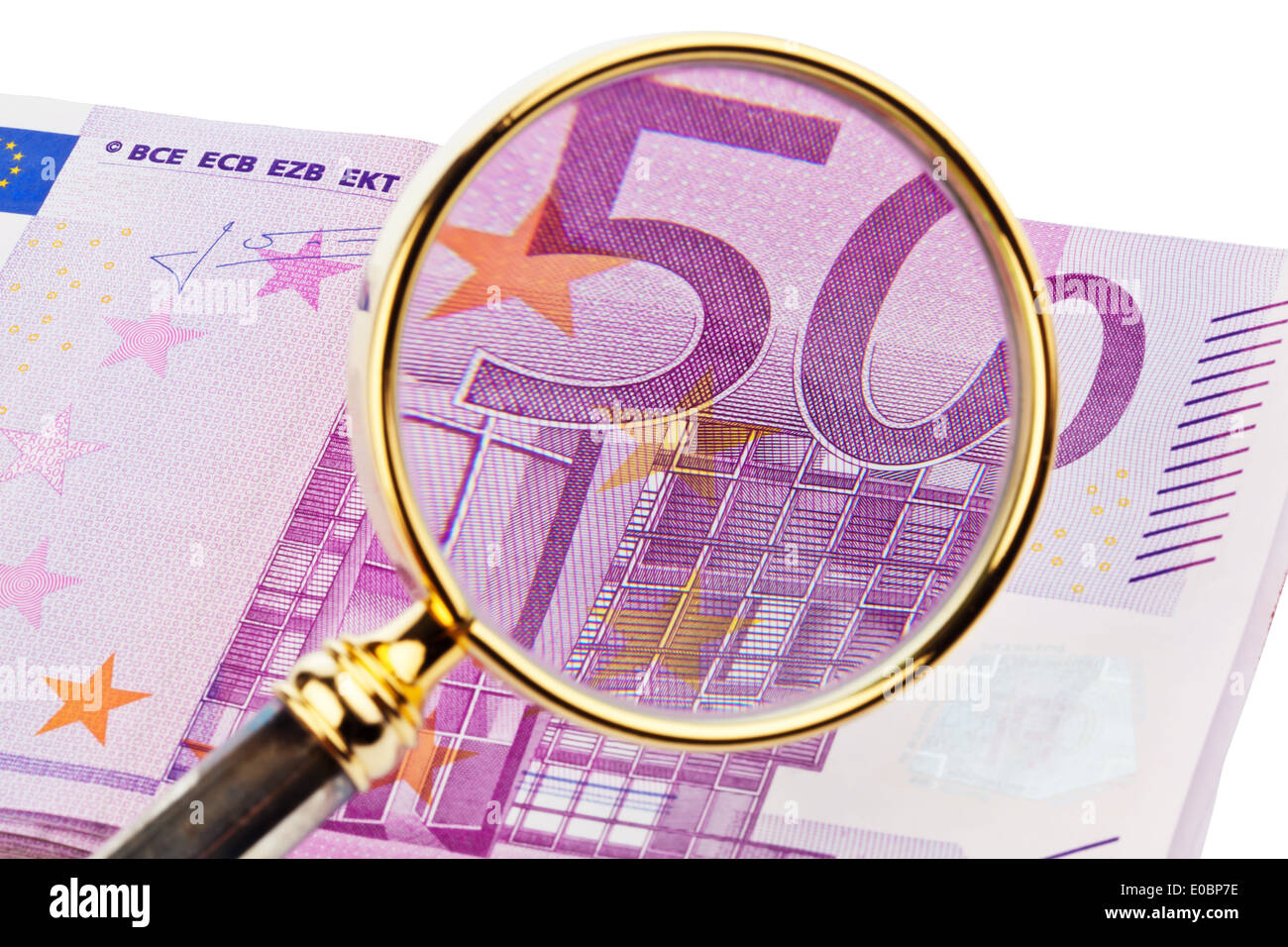 A lot of 500 euromoney bank notes lies on a pile. Seen by a magnifying ...