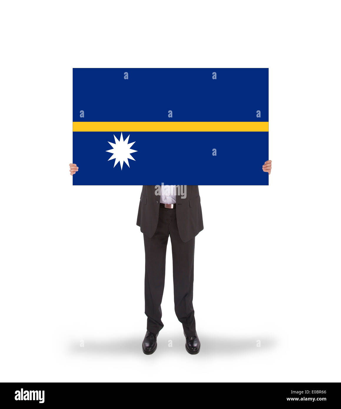 Businessman holding a big card flag of Nauru Stock Photo - Alamy