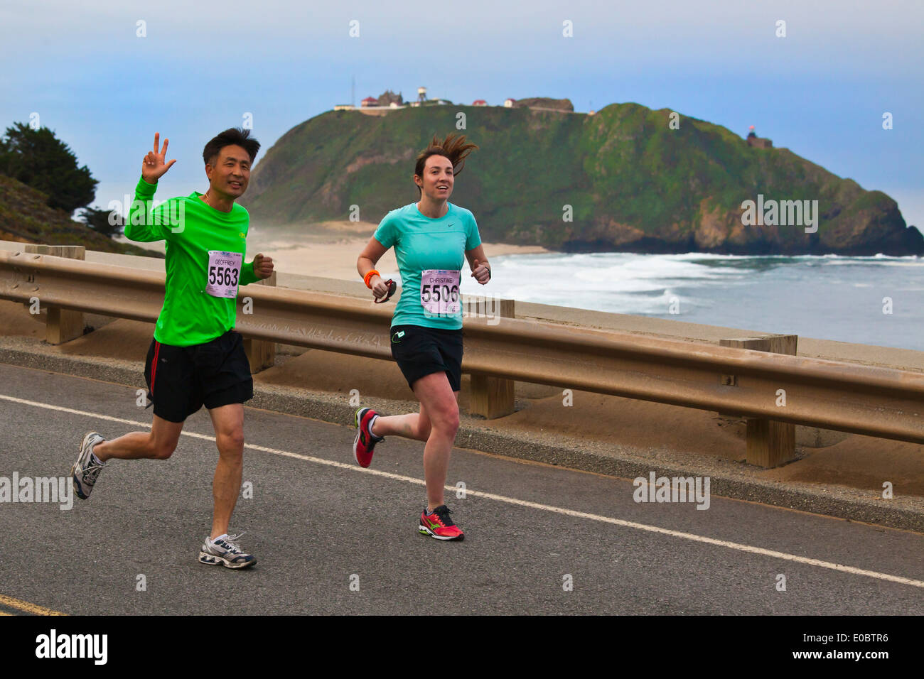 Runners pass the Point Sur lighthouse during the 2014 Big Sur Marathon ...