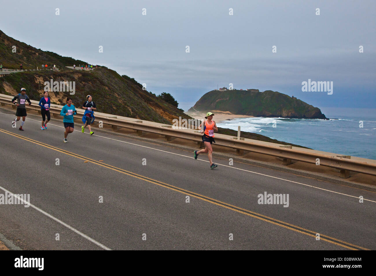 Runners pass the Point Sur lighthouse during the 2014 Big Sur Marathon ...