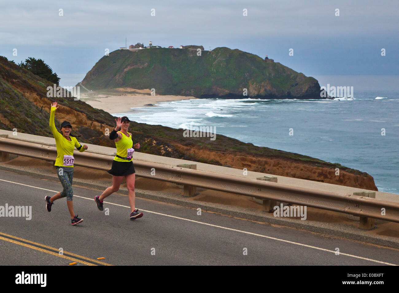 Runners pass the Point Sur lighthouse during the 2014 Big Sur Marathon ...