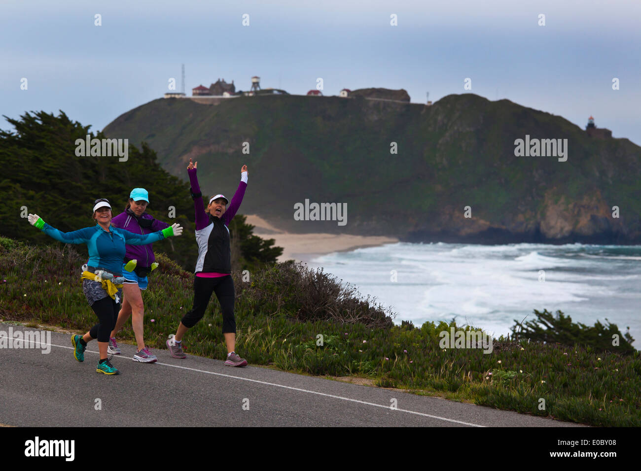 Runners pass the Point Sur lighthouse during the 2014 Big Sur Marathon ...