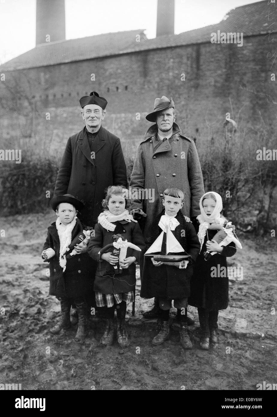 This photo shows a Belgian priest and an Australian padre with village ...