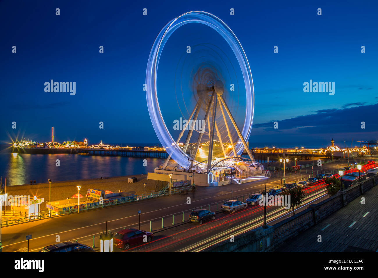 The Brighton Wheel and Pier spinning at night, Brighton, East Sussex ...