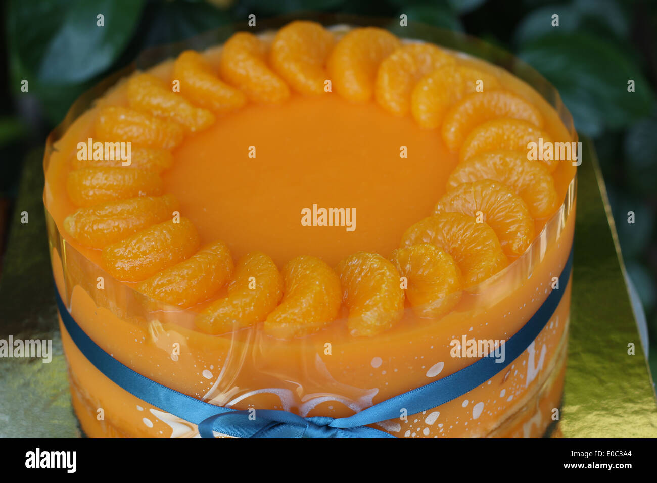 Orange cake with orange topping Stock Photo - Alamy