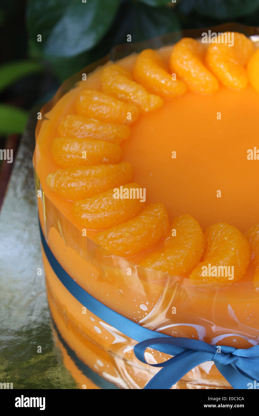 Orange cake with orange topping Stock Photo - Alamy