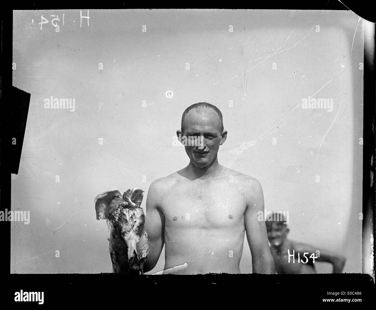 A historical photograph of the winner of a duck hunting competition ...