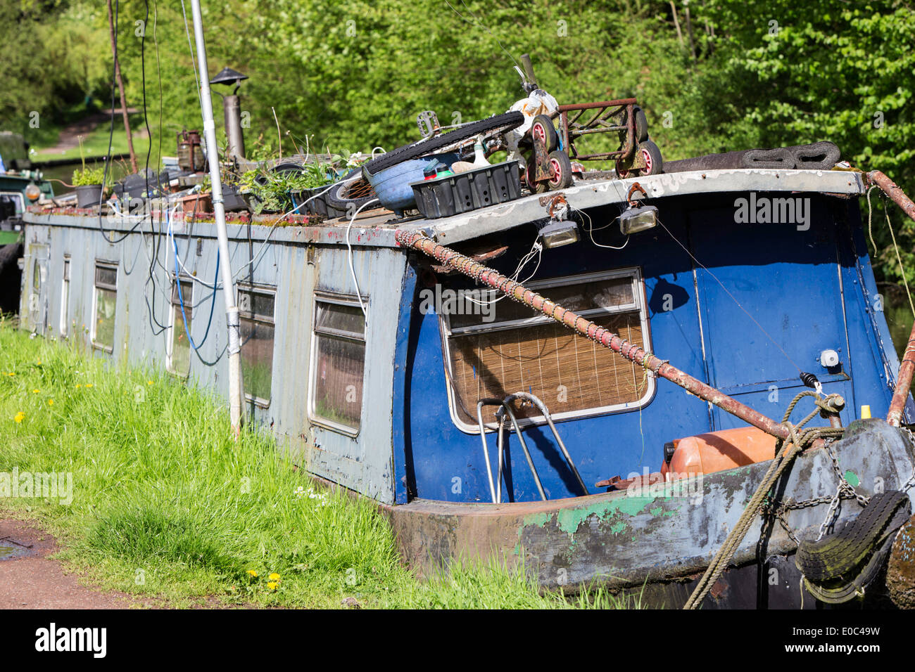 Old narrowboat moored on the Staffordshire and Worcester Canal, England ...