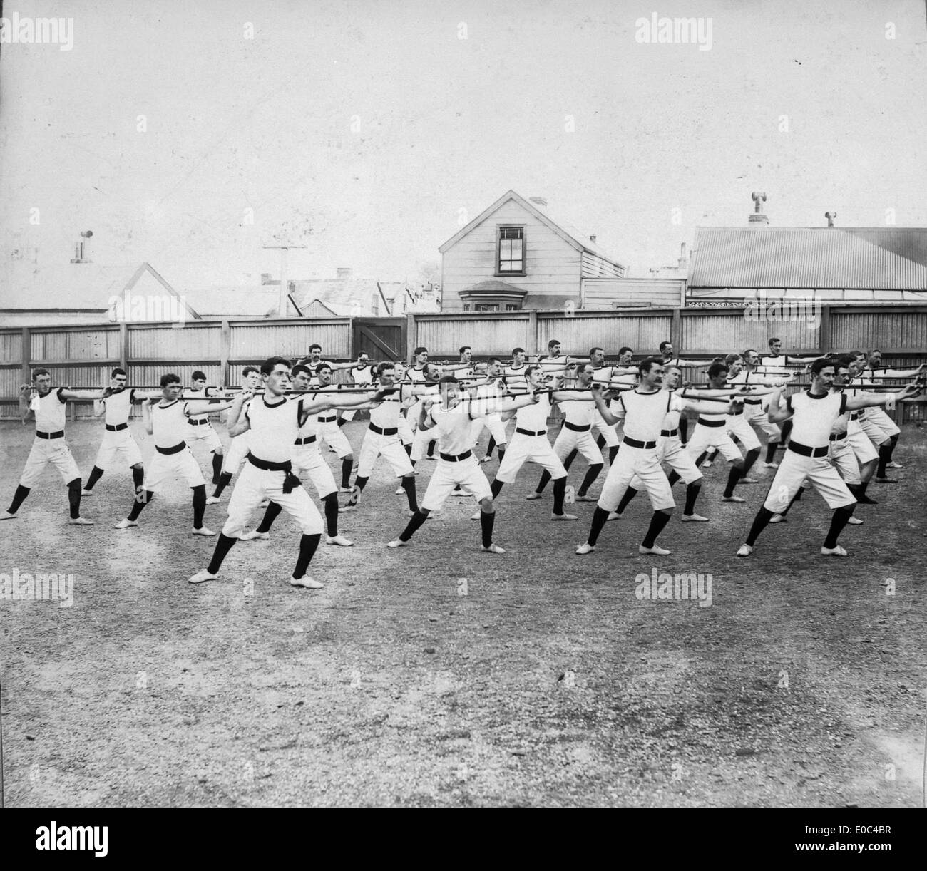 A photograph from 1898 depicting men performing stretches at the ...