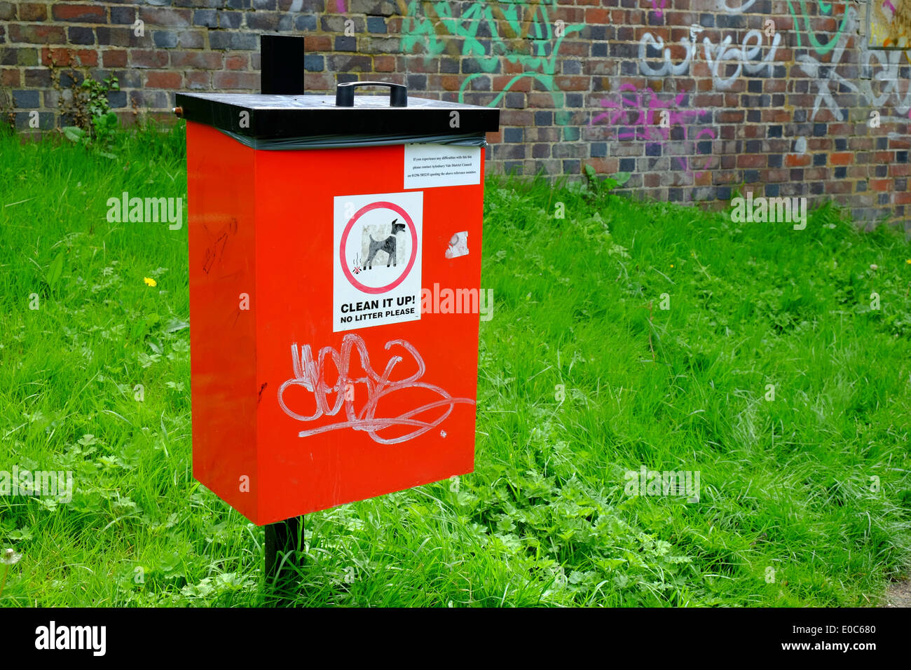 Dog waste bin & Graffiti Stock Photo - Alamy