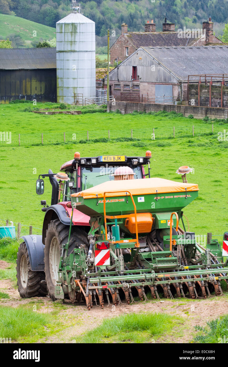 A seed drilling rig on the back of a tractor at a farm in Kirkoswold in ...