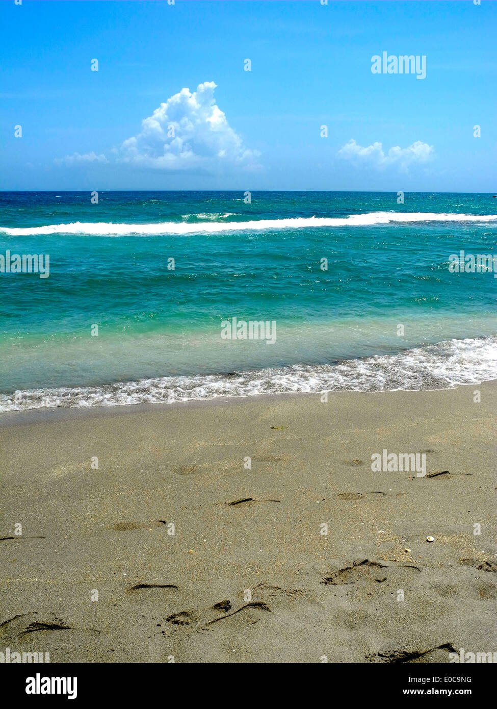 Clouds Over a Beautiful Beach The clouds appear to give a "thumbs up ...