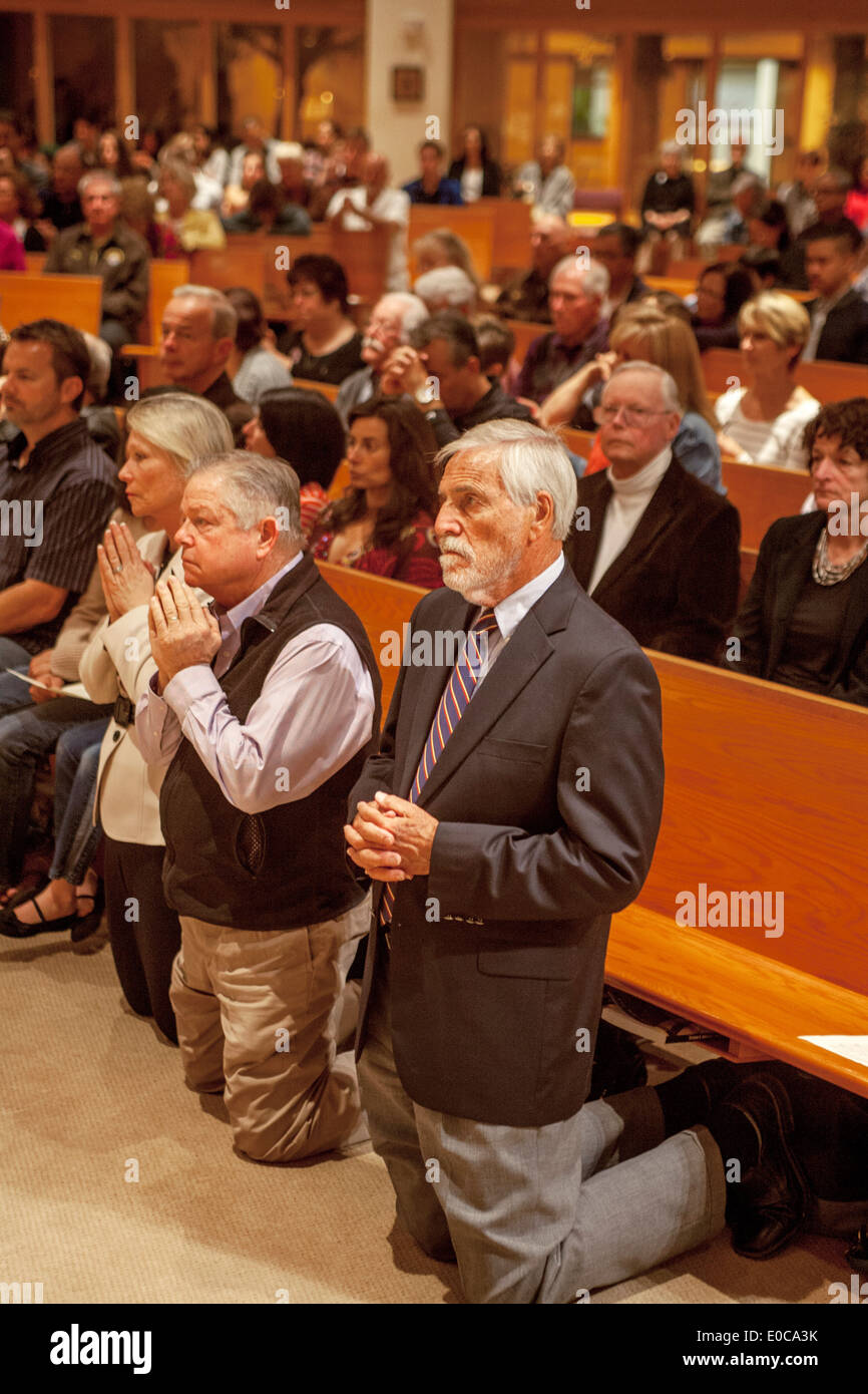 Group Praying On Knees