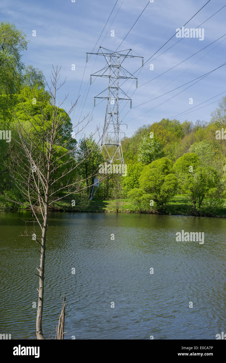 High-voltage electric line over lake Stock Photo - Alamy