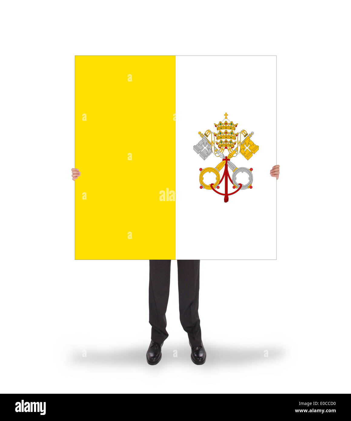 Businessman holding a big card flag of Vatican City isolated on white ...