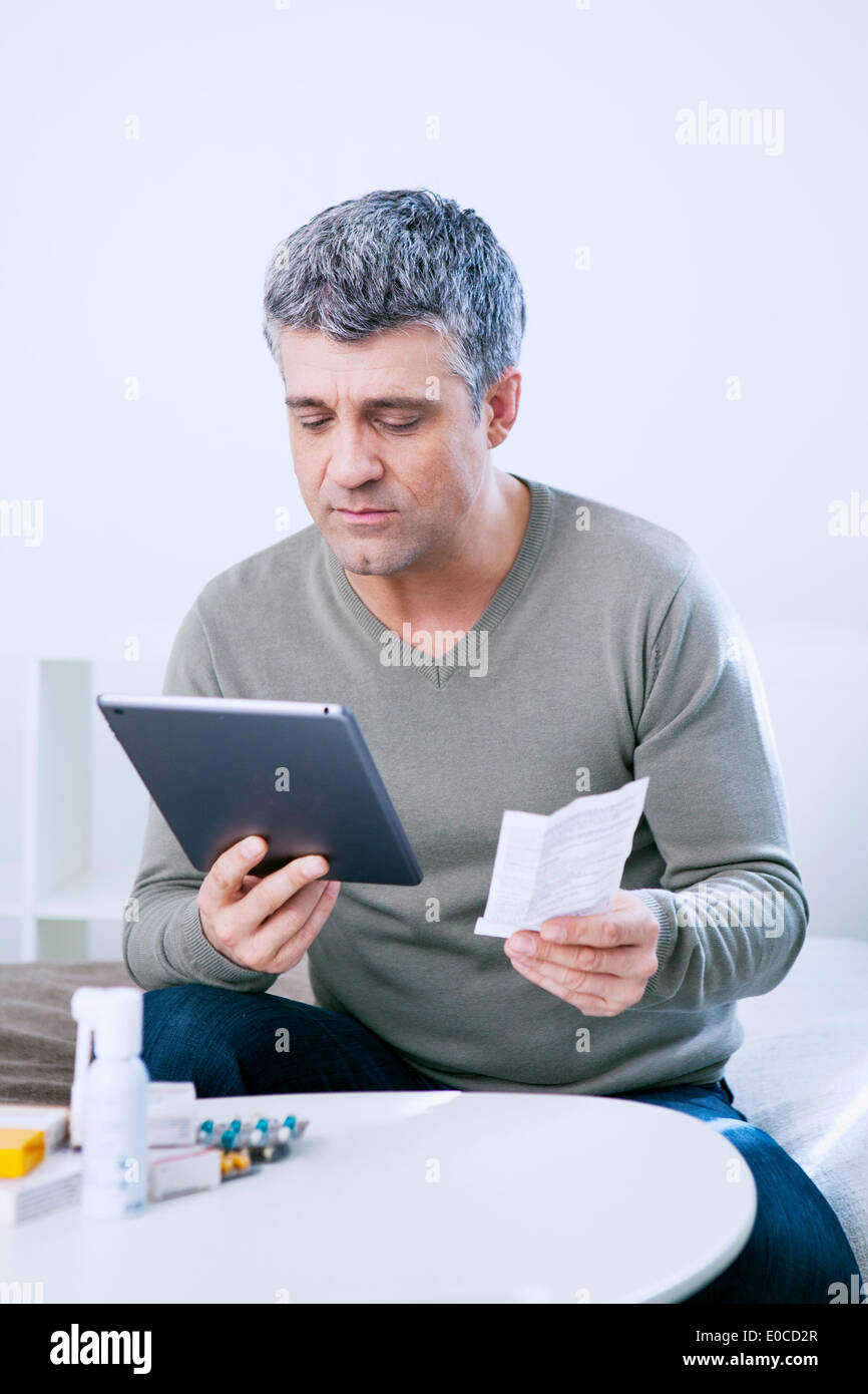 Man taking medication Stock Photo - Alamy
